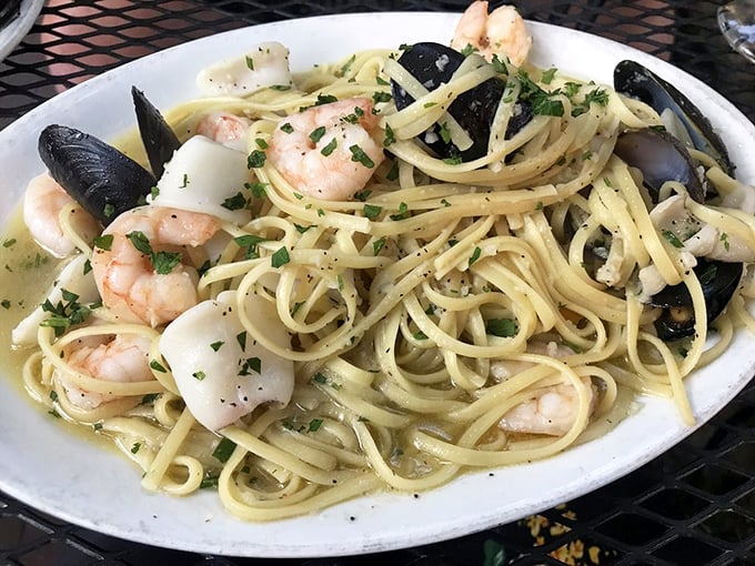 Seafood linguine that brings the ocean to Ohio – a maritime miracle of tender shellfish and perfectly al dente pasta.