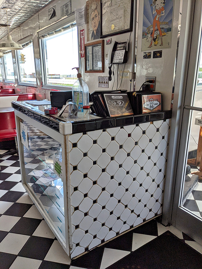 The host station—first checkpoint on your journey to deliciousness. Those black and white tiles have guided hungry travelers for generations.