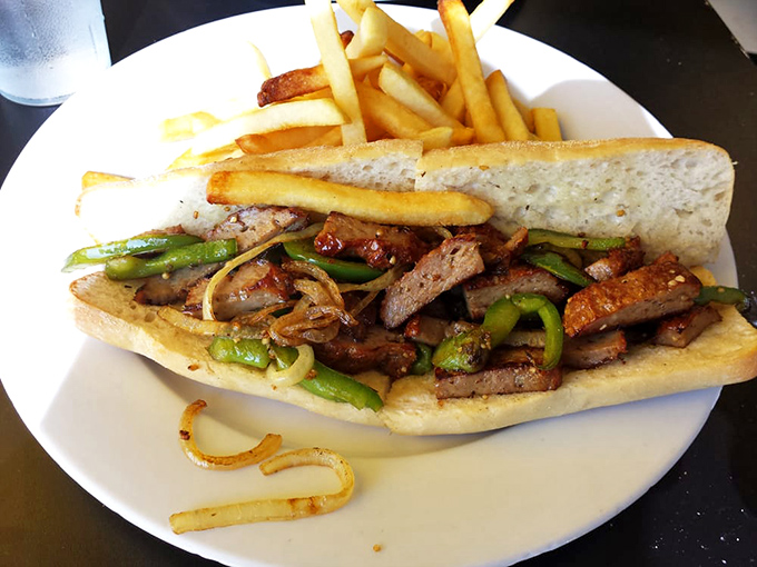 The Italian sausage and pepper sandwich that makes you question why you'd ever eat anything else for lunch. Those caramelized onions deserve their own fan club.