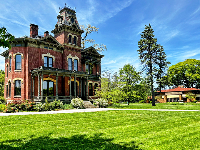 The James Millikin Homestead stands as a Victorian masterpiece, its brick facade and ornate trim showcasing the prosperity that once flowed through Decatur.
