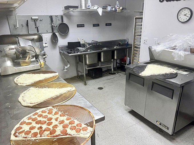 Behind the scenes where pizza magic happens &ndash; like Willy Wonka's factory, but with more cheese and significantly fewer Oompa Loompas.