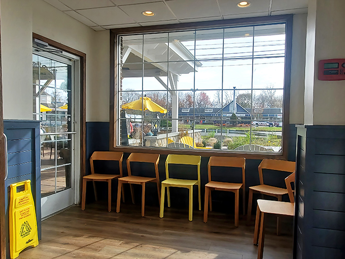 The waiting area where breakfast anticipation builds to a fever pitch. That lone yellow chair is making a statement we can all respect.