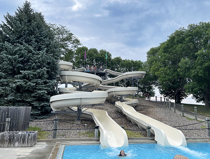 Water slides that deliver equal parts joy and velocity, ending with the universal sound of summer: happy splashing.