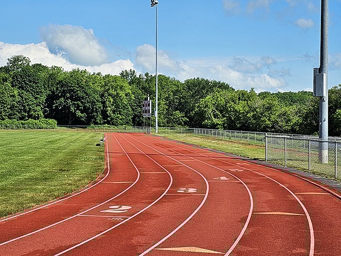 Monadnock Park's running track curves gracefully against a backdrop of verdant trees, inviting both serious athletes and casual walkers to make their rounds.