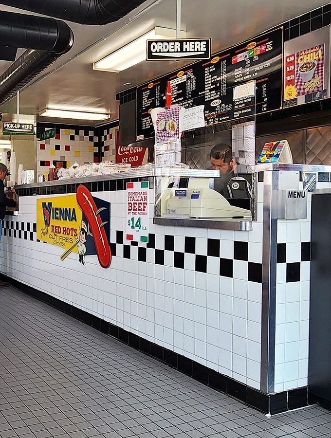 The order counter—where dreams are spoken aloud and transformed into beef-laden reality by the wizards behind the tile.