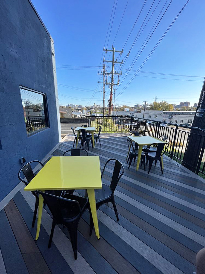 Outdoor seating with a view of Richmond that says, "Yes, you can enjoy your burger with a side of fresh air and urban scenery."