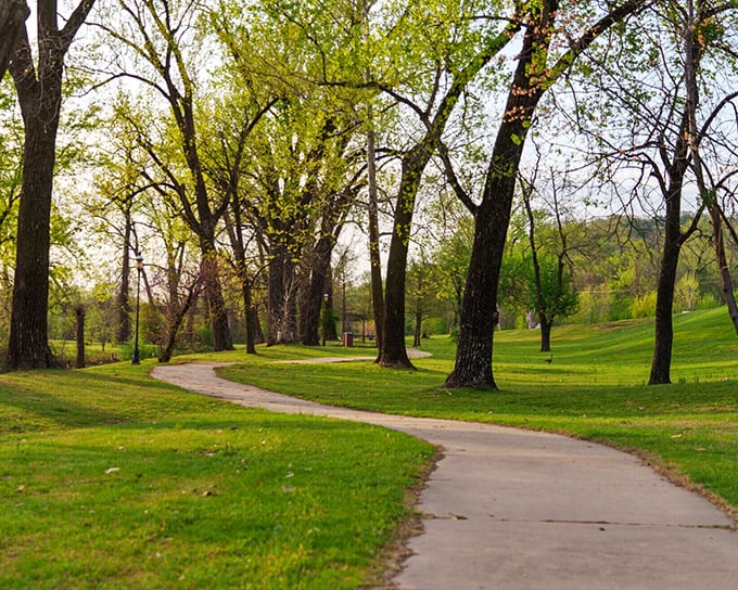 Park paths wind through mature trees where walking is free and nobody's timing your productivity metrics.