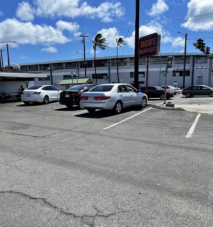 A parking lot filled with both work trucks and rental cars&mdash;the universal sign that you've found somewhere authentically delicious.