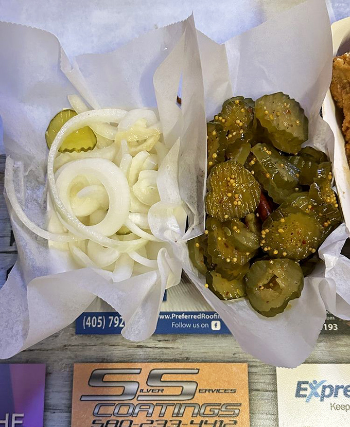 The supporting cast: Sliced onions and pickles that aren't mere garnishes but essential characters in the Eischen's flavor story.