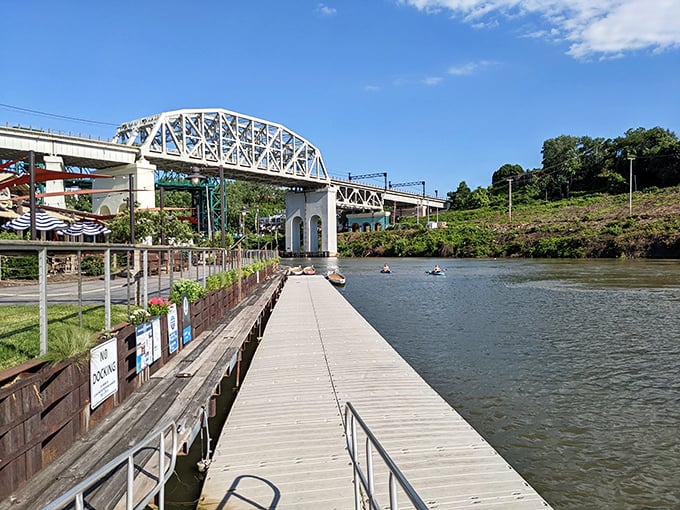 The Cuyahoga River's wooden boardwalks invite exploration beneath historic bridges, where industrial history meets recreational renaissance.