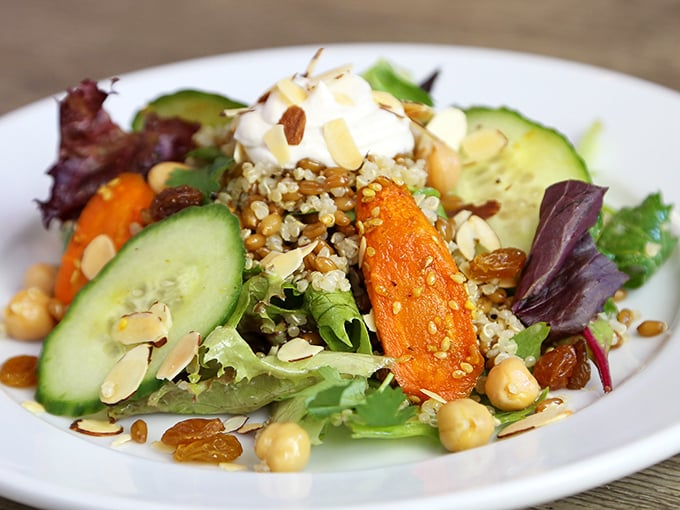 A salad that doesn't apologize for being healthy. Those toasted almonds and quinoa are wearing their nutritional superhero capes with pride.