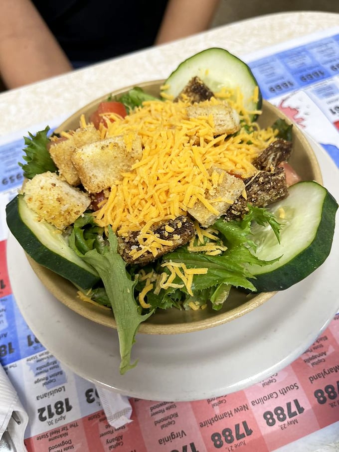 A salad that doesn't apologize for being healthy. Those shredded cheese and crouton co-stars deserve their own billing.