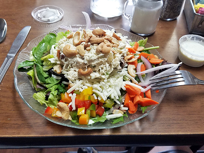 This salad proves the diner does more than breakfast&mdash;a colorful mountain of freshness topped with cashews and what appears to be chicken salad.