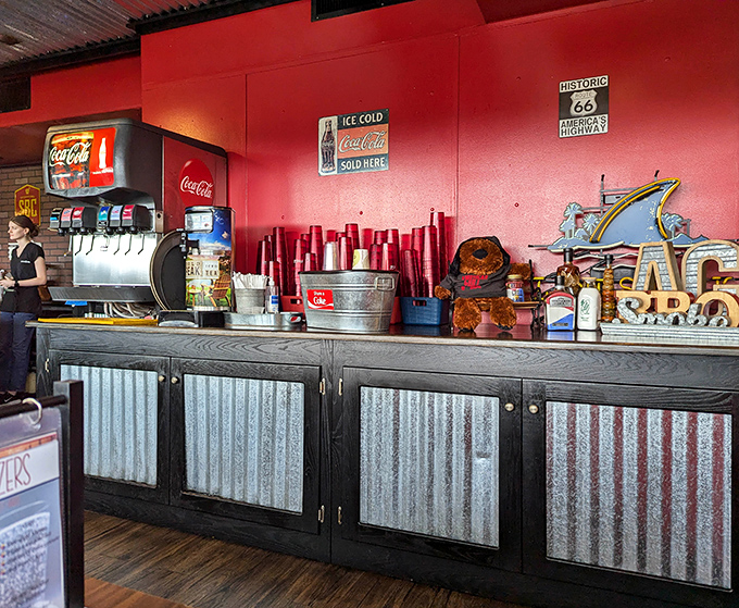 Self-service stations with classic Coca-Cola branding and Route 66 memorabilia add to the all-American road trip vibe.