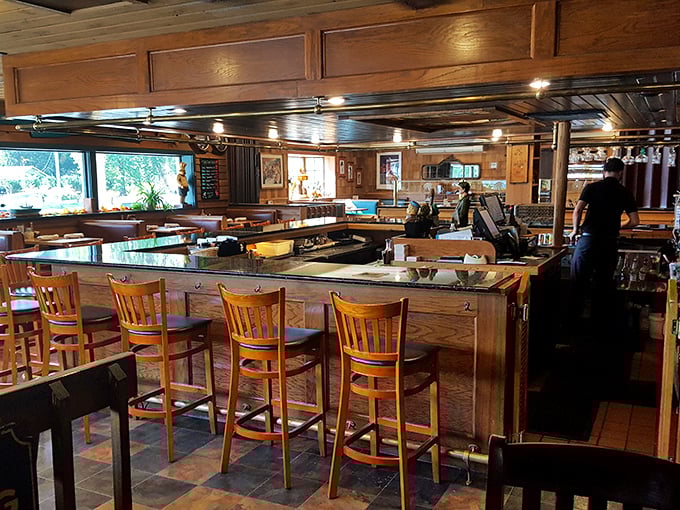 The bar area invites you to settle in for stories and spirits. Those wooden booths have probably heard tales that would make a sailor blush.