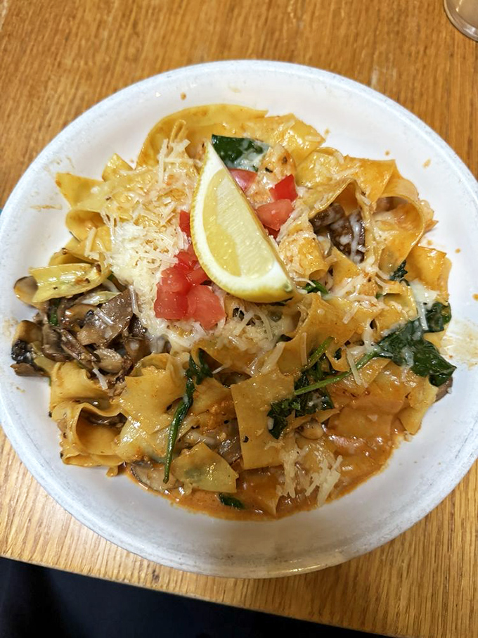 Pasta that's taken a southwestern vacation &ndash; pappardelle mingling with mushrooms, tomatoes and herbs under a sprinkle of parmesan and a squeeze of lemon.