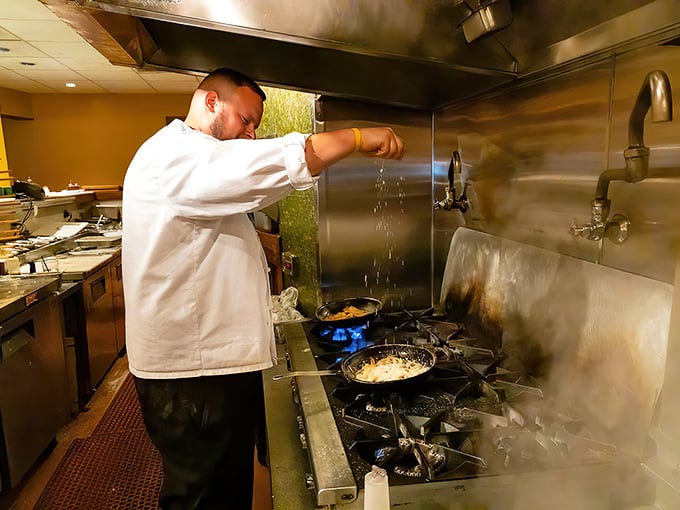 In the kitchen's controlled chaos, culinary magic happens&mdash;each flick of the wrist adding flavor that will soon make someone's evening.