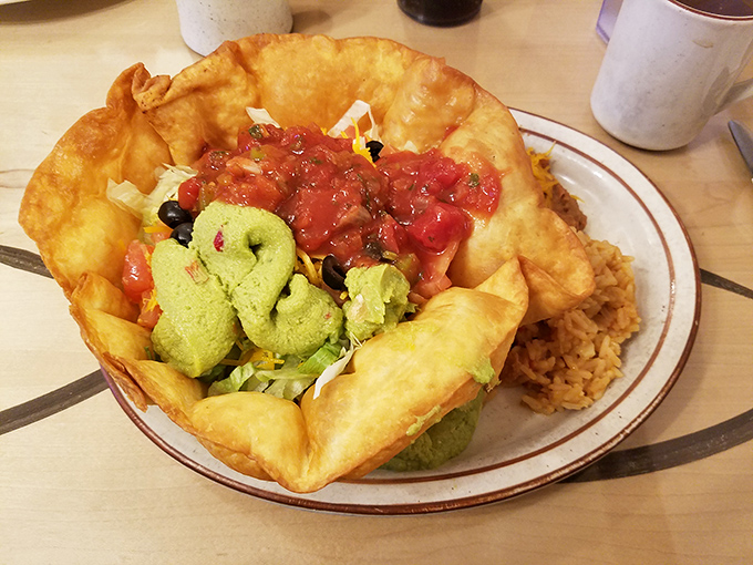 This taco salad bowl isn't just food &ndash; it's edible architecture. The crispy shell cradles fresh ingredients like a tortilla hammock of deliciousness.