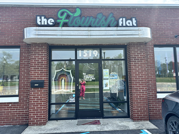 The Flourish Flat brings a splash of modern entrepreneurial spirit to Genoa's brick-lined streetscape with its inviting storefront.