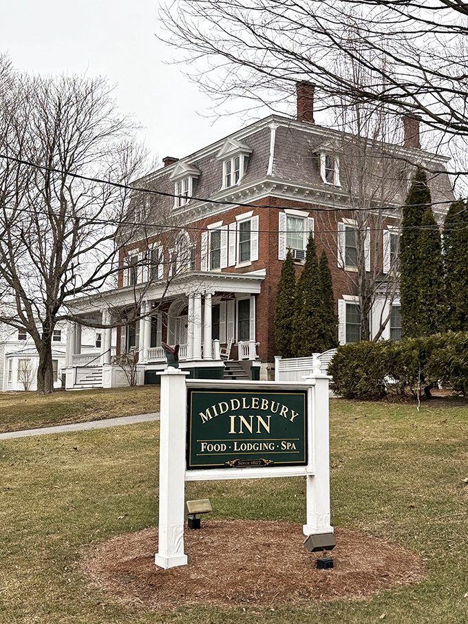 The Middlebury Inn stands as a stately reminder that hospitality never goes out of style, especially when wrapped in historic brick and white columns.