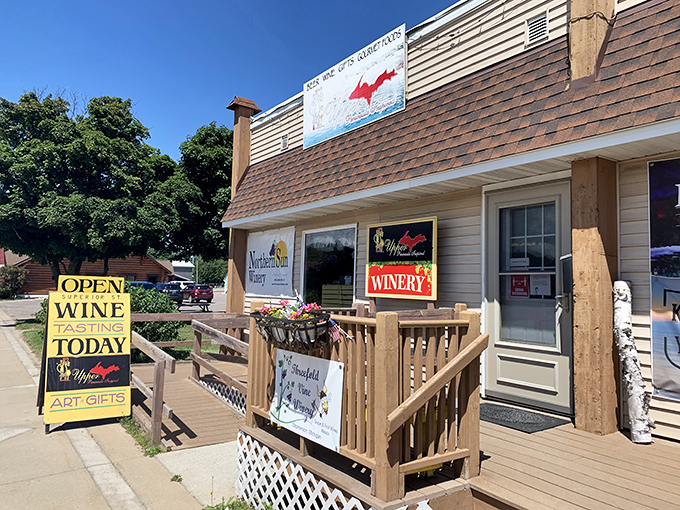 A charming winery beckons with its wooden deck and cheerful "Wine Tasting Today" sign&mdash;proof that even in Michigan's north country, vineyard culture thrives.