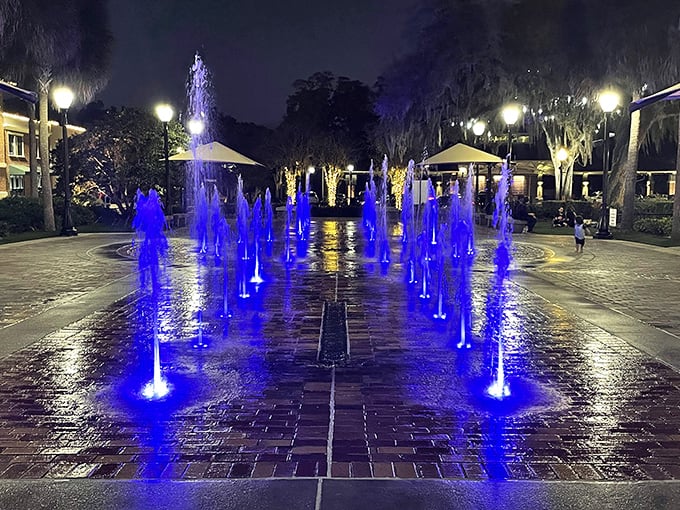 Winter Garden's interactive fountain transforms into a magical light show at night, where dancing blue waters create memories more lasting than any souvenir.