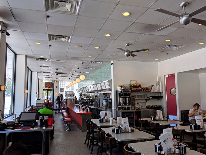 Morning light streams through windows that have witnessed Atlanta's evolution one pancake at a time.