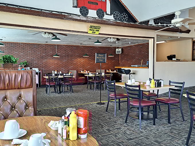 Brick walls and comfortable booths create distinct dining zones, proving someone put actual thought into this roadside haven's layout.
