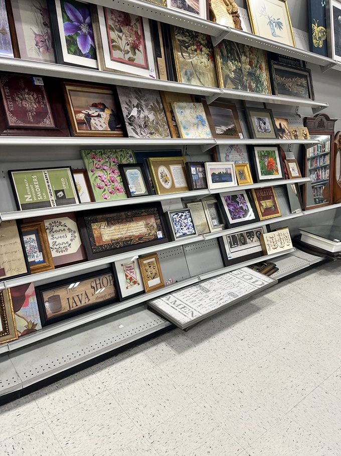 Wall art for every taste lines these shelves&mdash;from inspirational quotes to vintage botanicals. Someone's discarded "Live, Laugh, Love" becomes your ironic statement piece.