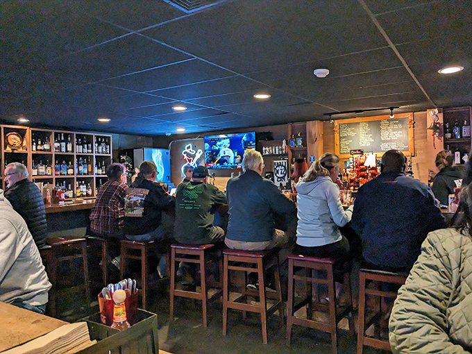 The bar area transforms strangers into friends, united by the universal language of "Did you try the brisket yet?"
