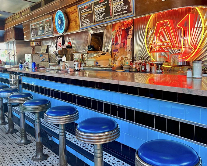 The counter view &ndash; where culinary magic happens. Blue stools invite you to sit and watch the choreographed dance of short-order cooking.