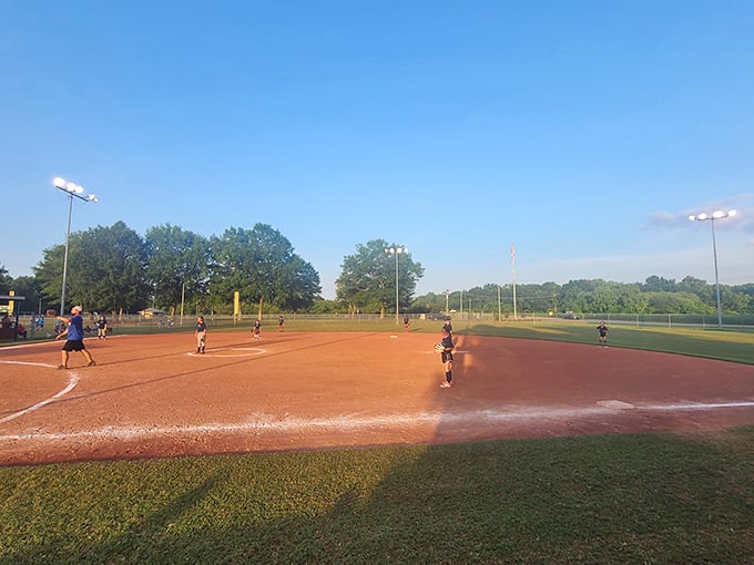 New Albany's baseball fields host dreams and friendly rivalries under golden evening light. Here, community happens one inning, one cheer, one hot dog at a time.