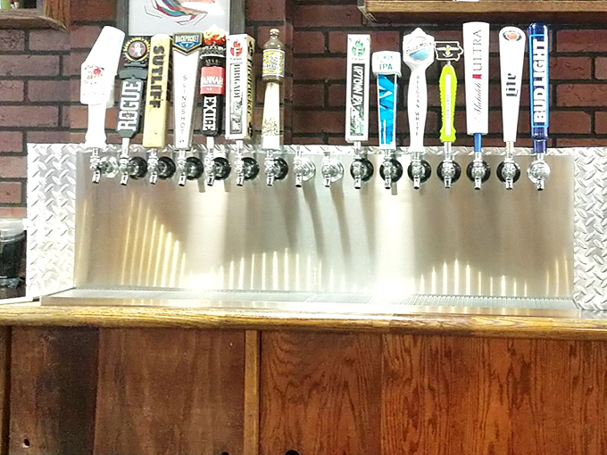 The tap lineup stands at attention like wrestlers awaiting introduction. Each handle tells a story of craft and flavor.