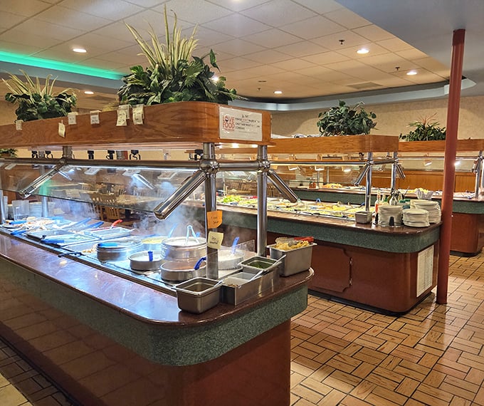 Steam rises from the buffet stations like a culinary fog, protecting a landscape of dishes that await your exploration.