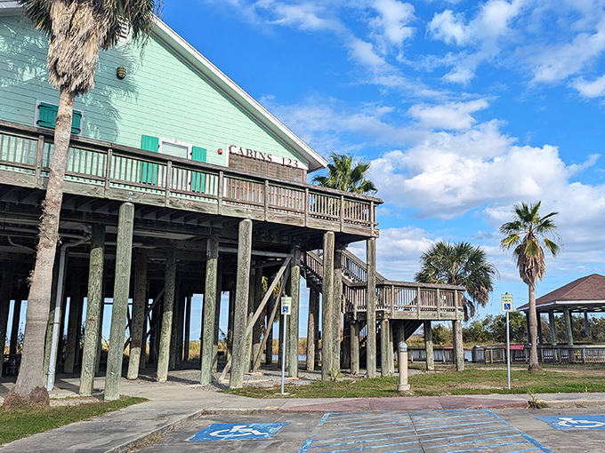 Mint-green cabins perched on stilts like coastal herons – these weathered beauties have witnessed countless sunrises while keeping their guests high and dry.