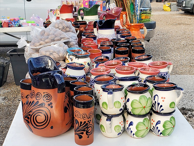 Handcrafted pottery with vibrant designs brings a touch of artisanal class to the market. That orange pitcher would look perfect in your kitchen.
