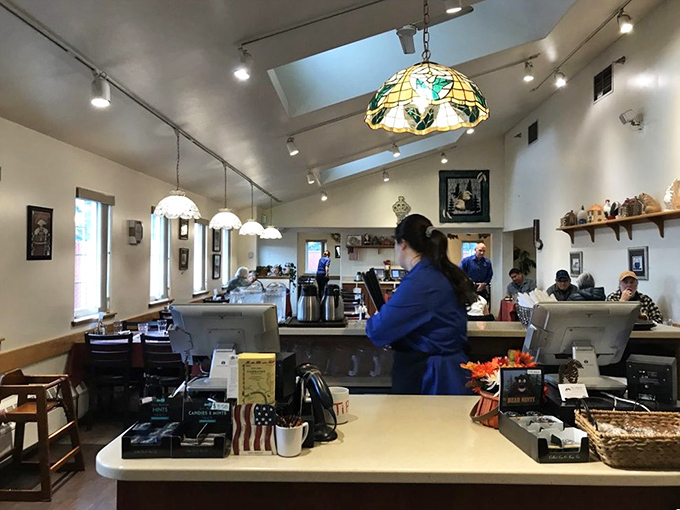 Where the magic happens&mdash;servers navigate the counter with the precision of air traffic controllers. The stained glass pendant lights add unexpected elegance.
