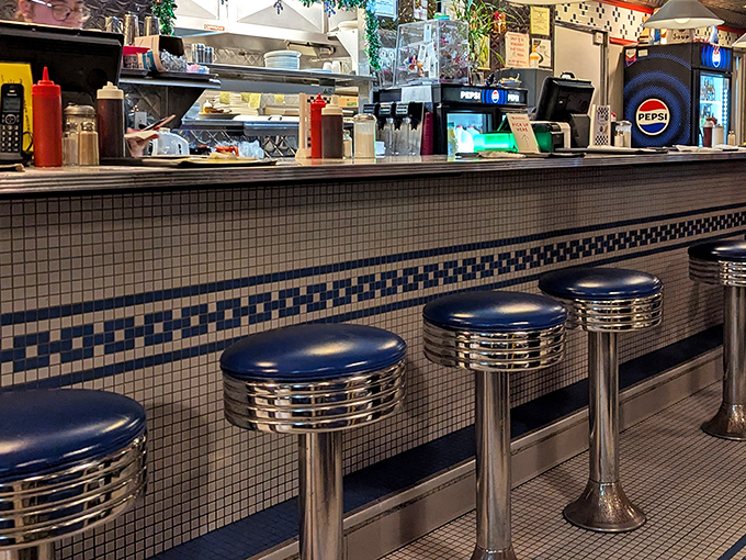 The counter stools aren't just seating &ndash; they're thrones for breakfast royalty. That blue and chrome combination has been saying "sit down and stay awhile" for generations.