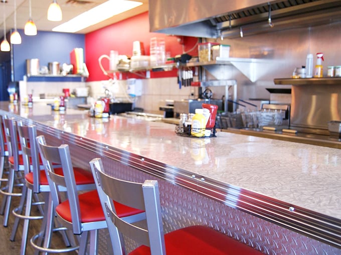 Counter seating: where solo diners become temporary food critics and the kitchen's symphony plays just feet away. The stainless steel gleams with possibilities.