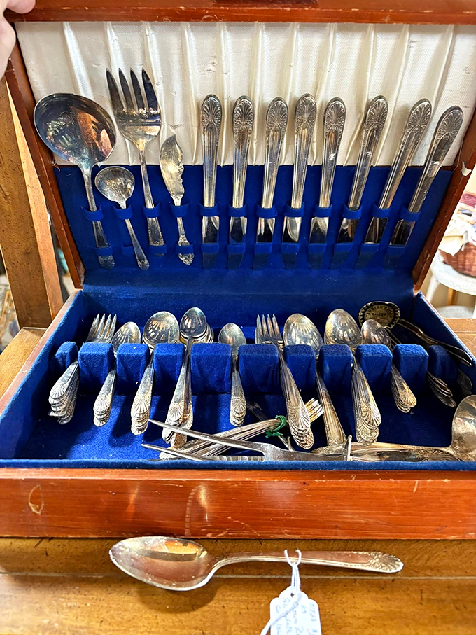 Silver that's dined with generations, nestled in royal blue velvet. These utensils have served everything from victory meals to TV dinners.