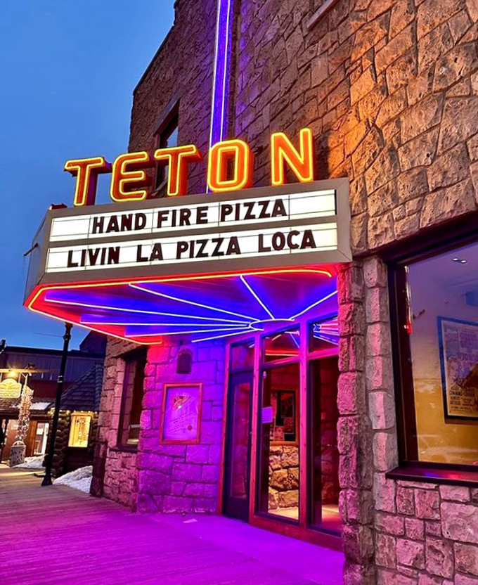 As dusk settles over Jackson, the marquee transforms into a beacon of neon promise for hungry travelers and locals alike.