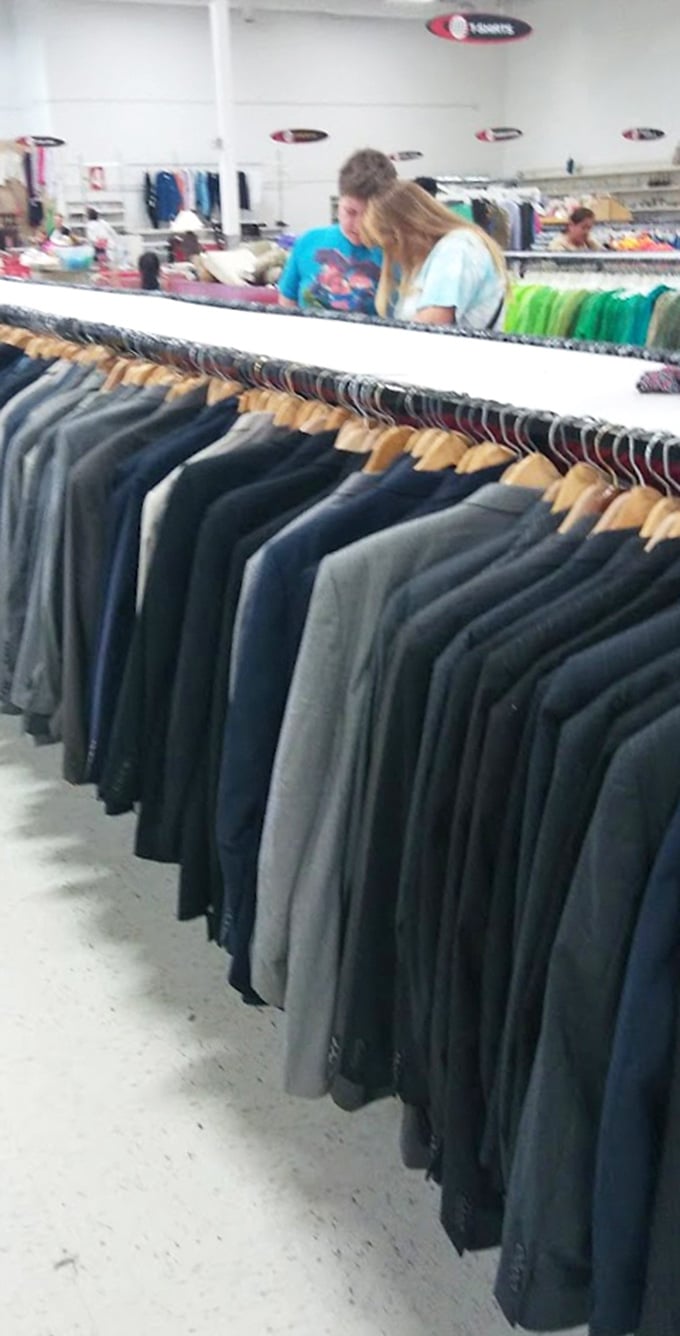 Men's formal wear stretches into the horizon, a sea of potential job interview outfits and wedding guest attire.