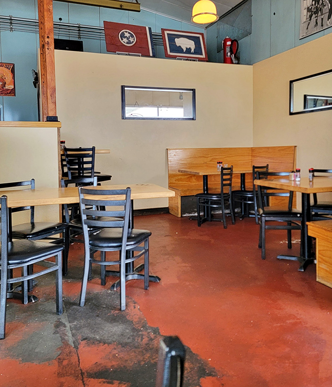 Wyoming pride adorns the walls above simple wooden booths. The red concrete floor has seen thousands of satisfied diners come and go.