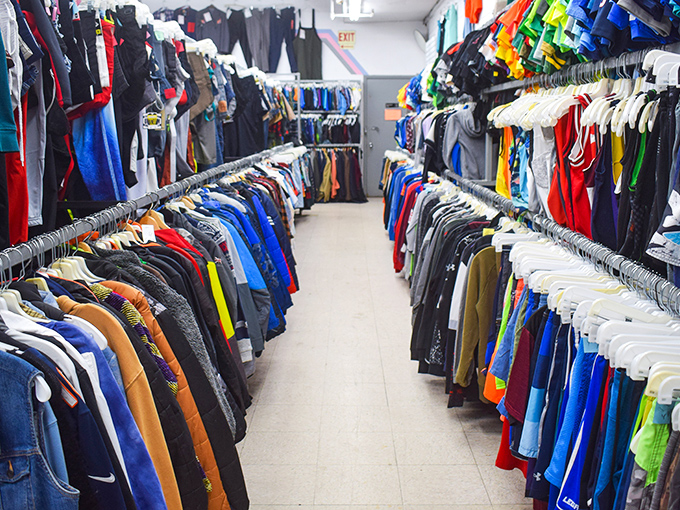 Men's clothing arranged with military precision—a testament to the fact that organization is the unsung hero of successful thrift shopping.