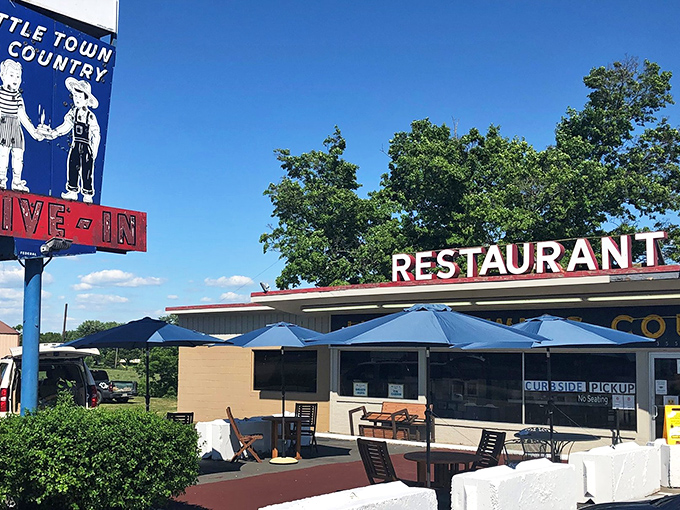 Summer brings umbrella-shaded tables and the restaurant's iconic sign standing tall. Even Kentucky sunshine knows this place is special.