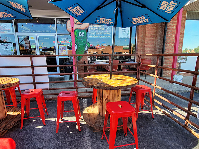 Red metal stools and repurposed cable spools create an outdoor oasis where the only thing better than the seating is what you're eating.