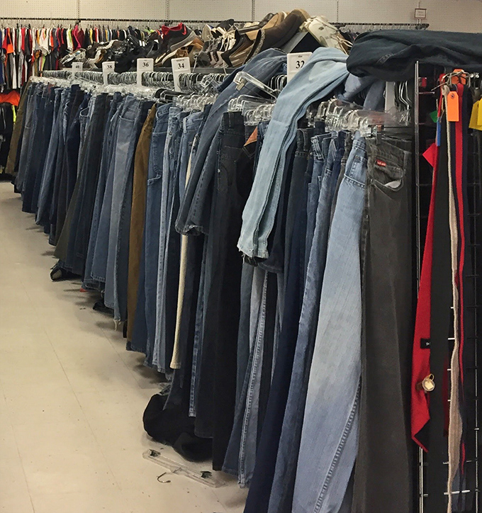 The denim section stretches like a blue horizon, each pair of jeans holding the promise of that perfect, already-broken-in fit.