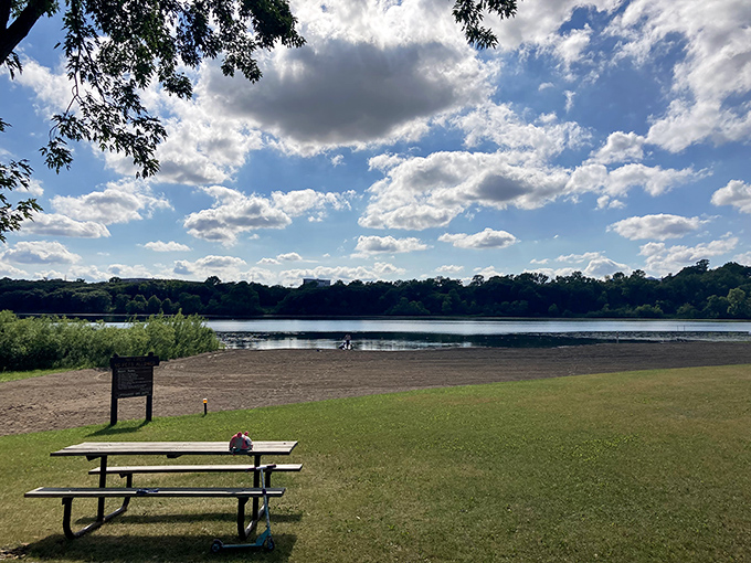 The perfect lunch spot awaits with this lakeside picnic table, offering front-row seats to a show that puts Broadway productions to shame.