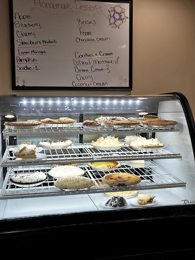 The pie display case—or as I call it, "The Museum of Delicious Decisions"—showcases homemade masterpieces that make choosing just one a genuine crisis.