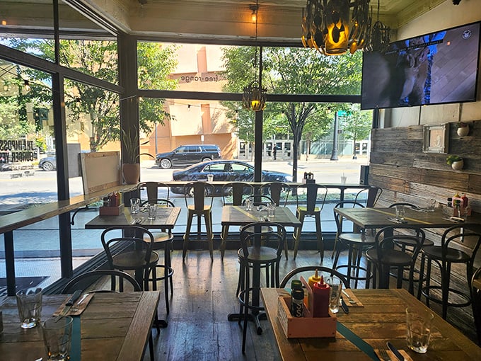 Floor-to-ceiling windows flood the dining area with natural light, creating a space where burgers and conversation flow with equal ease.